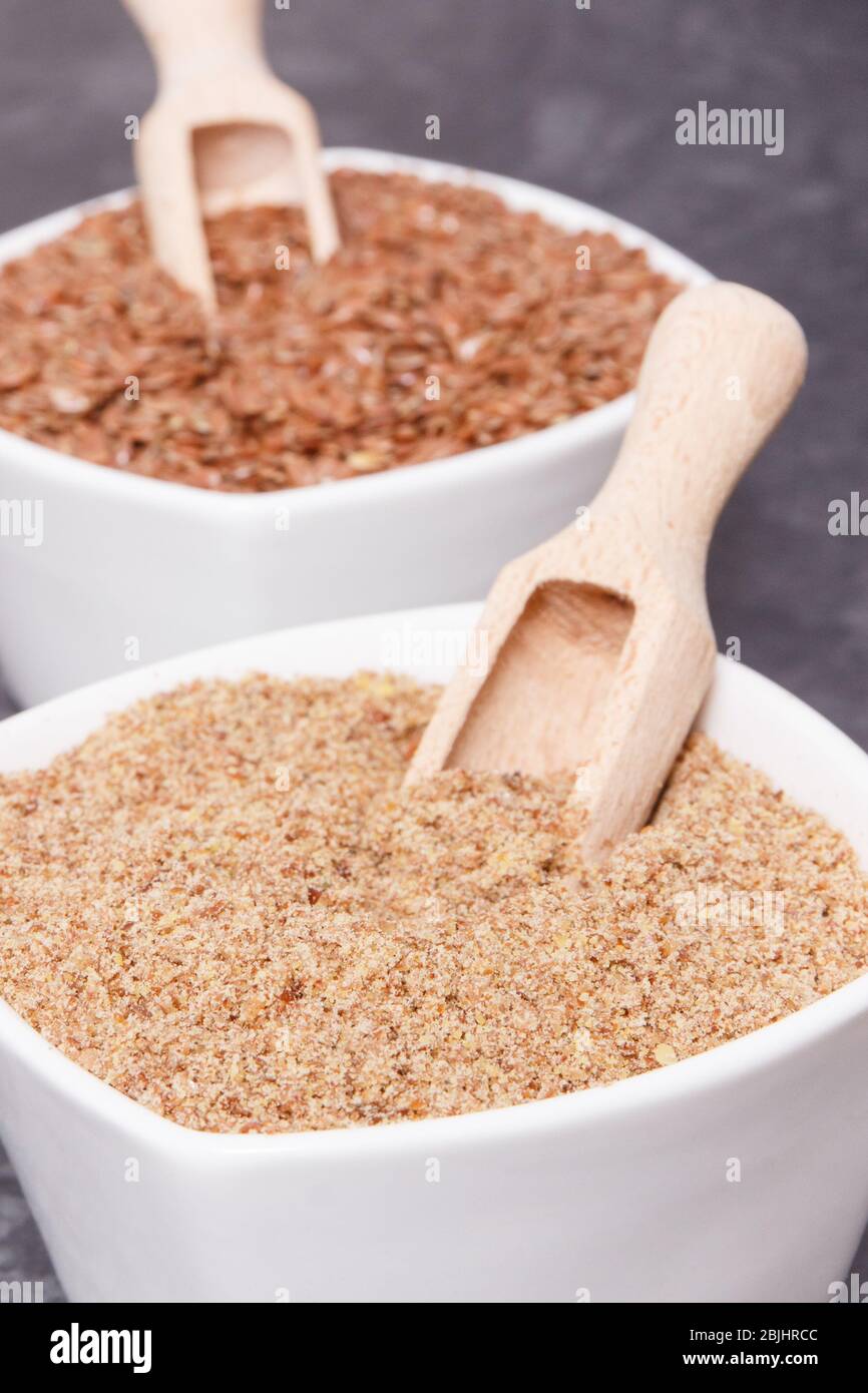 Linseed in white glass bowls as healthy food containing natural ...