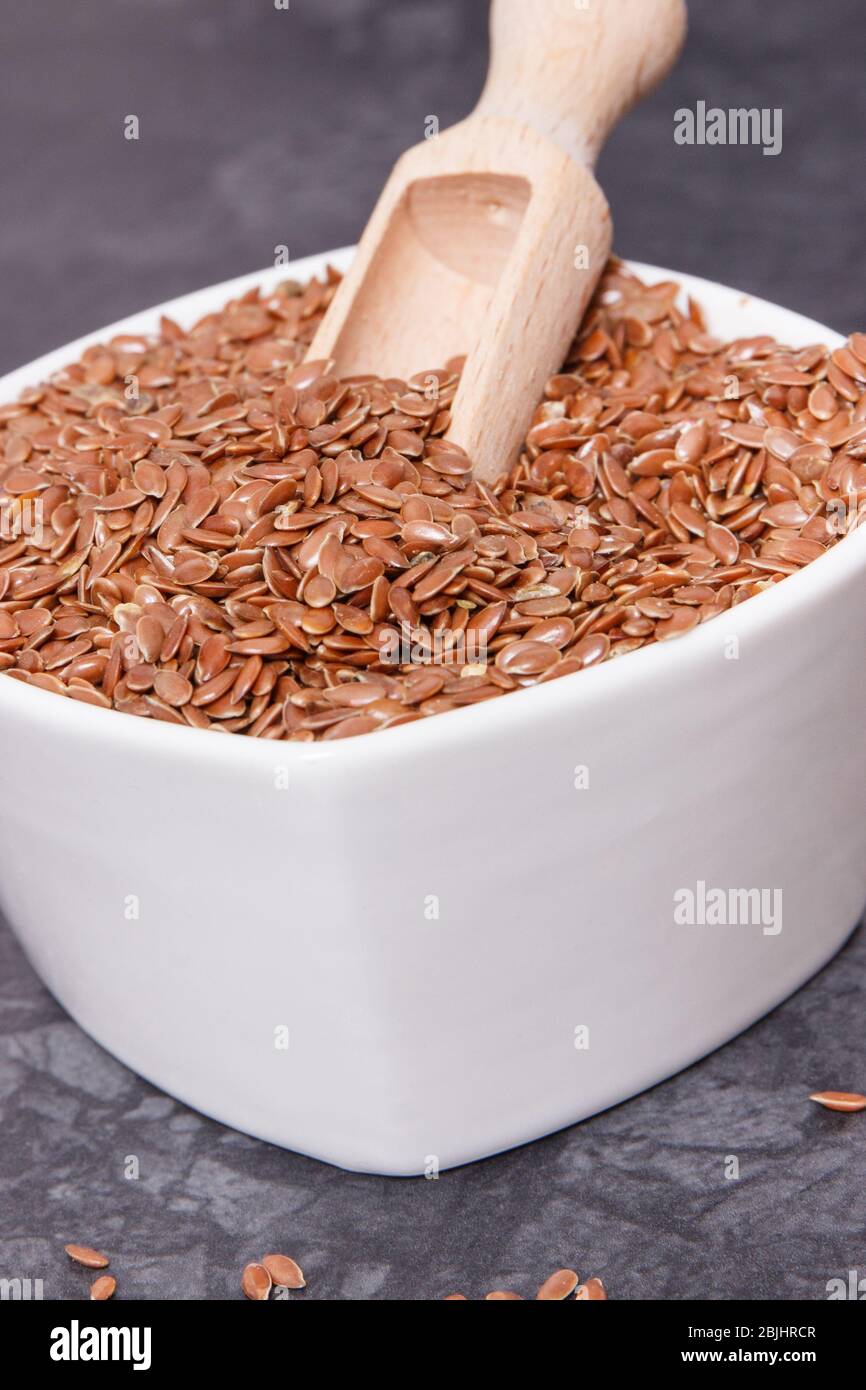 Linseed in white glass bowls as healthy food containing natural ...