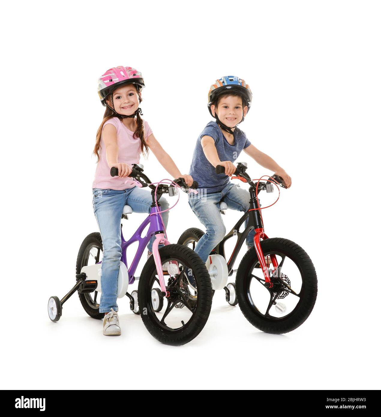 Cute little children with bicycles on white background Stock Photo - Alamy