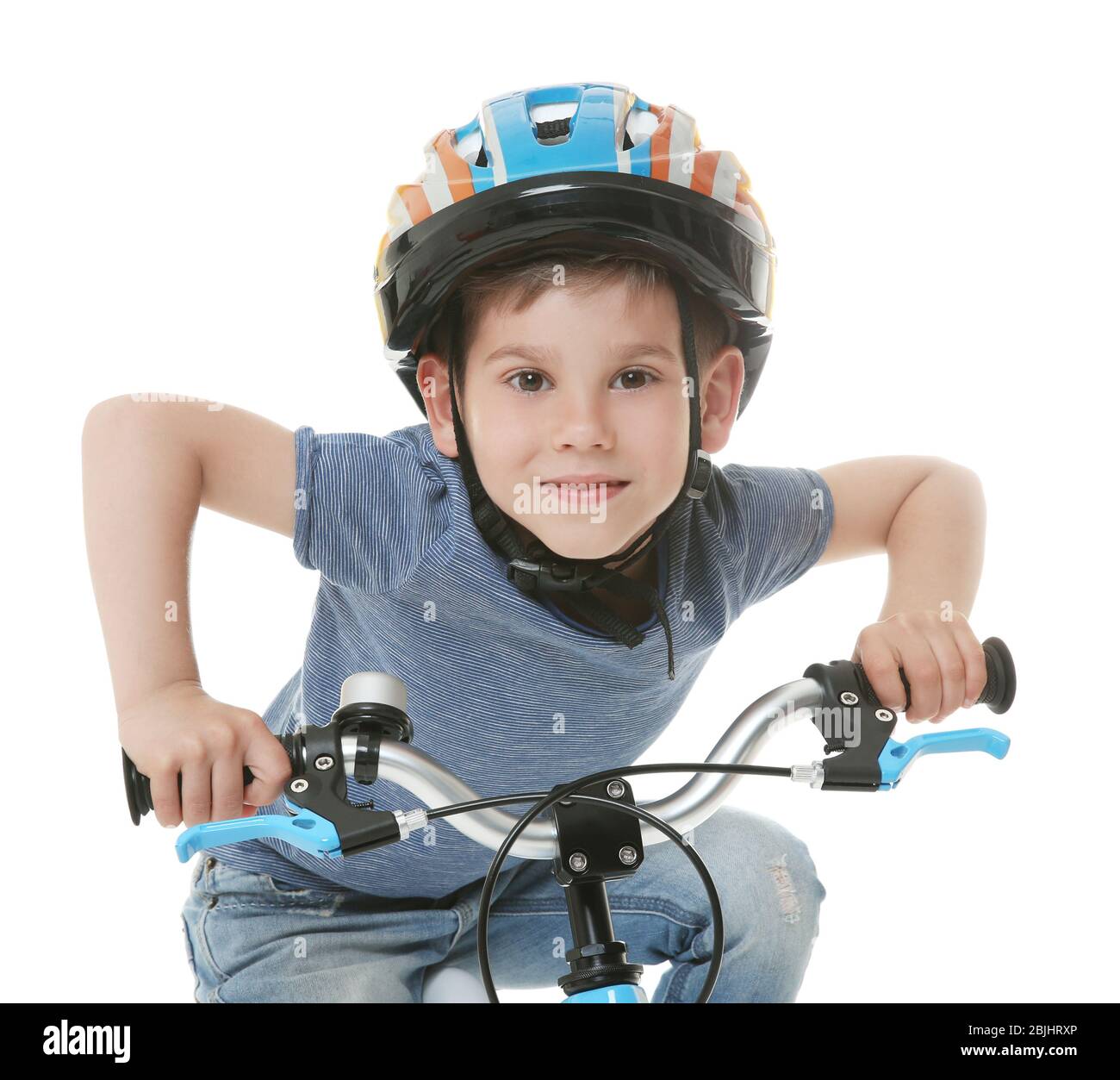 Cute little boy riding bicycle on white background Stock Photo - Alamy