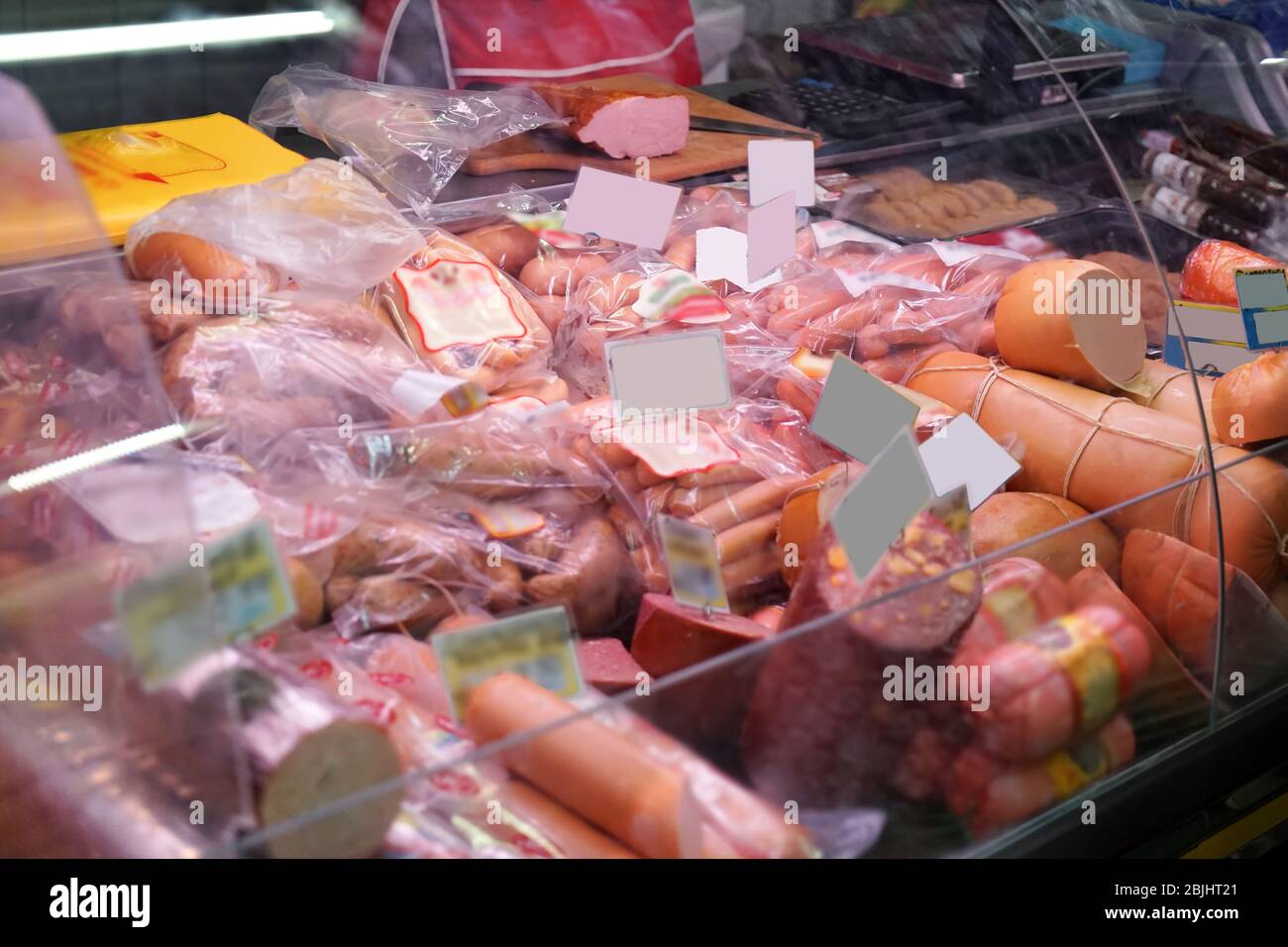Fresh sausage products in cooled display in supermarket Stock Photo - Alamy