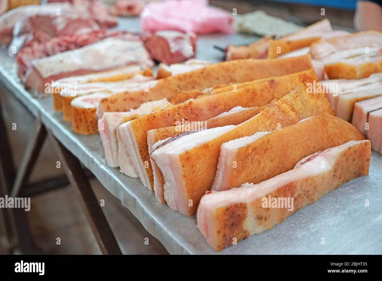 Fresh raw pork pieces on counter in market Stock Photo - Alamy