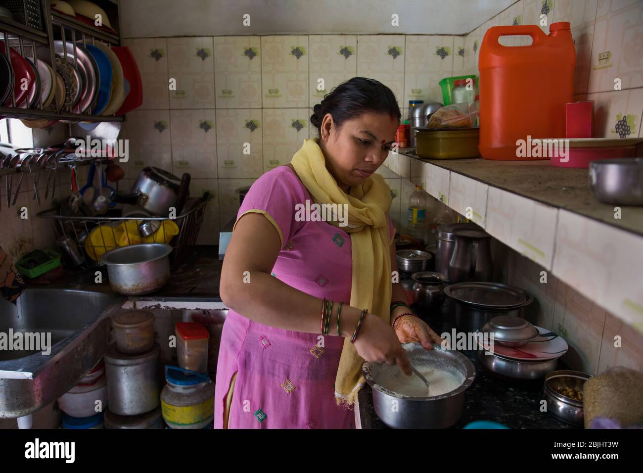 Indian lady cooking hi-res stock photography and images - Alamy