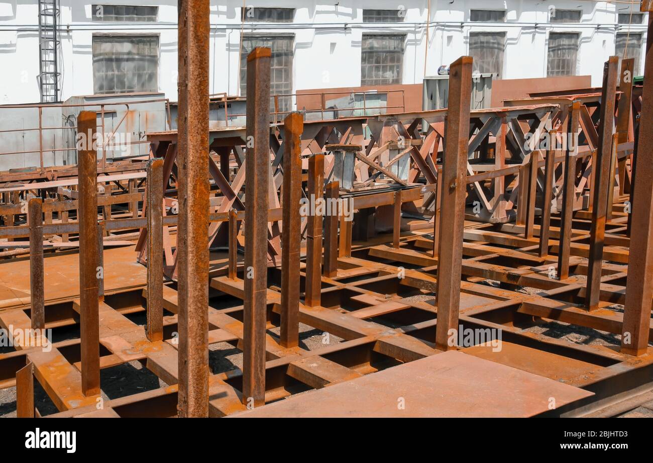 Metal supports for vessels in dockyard Stock Photo - Alamy