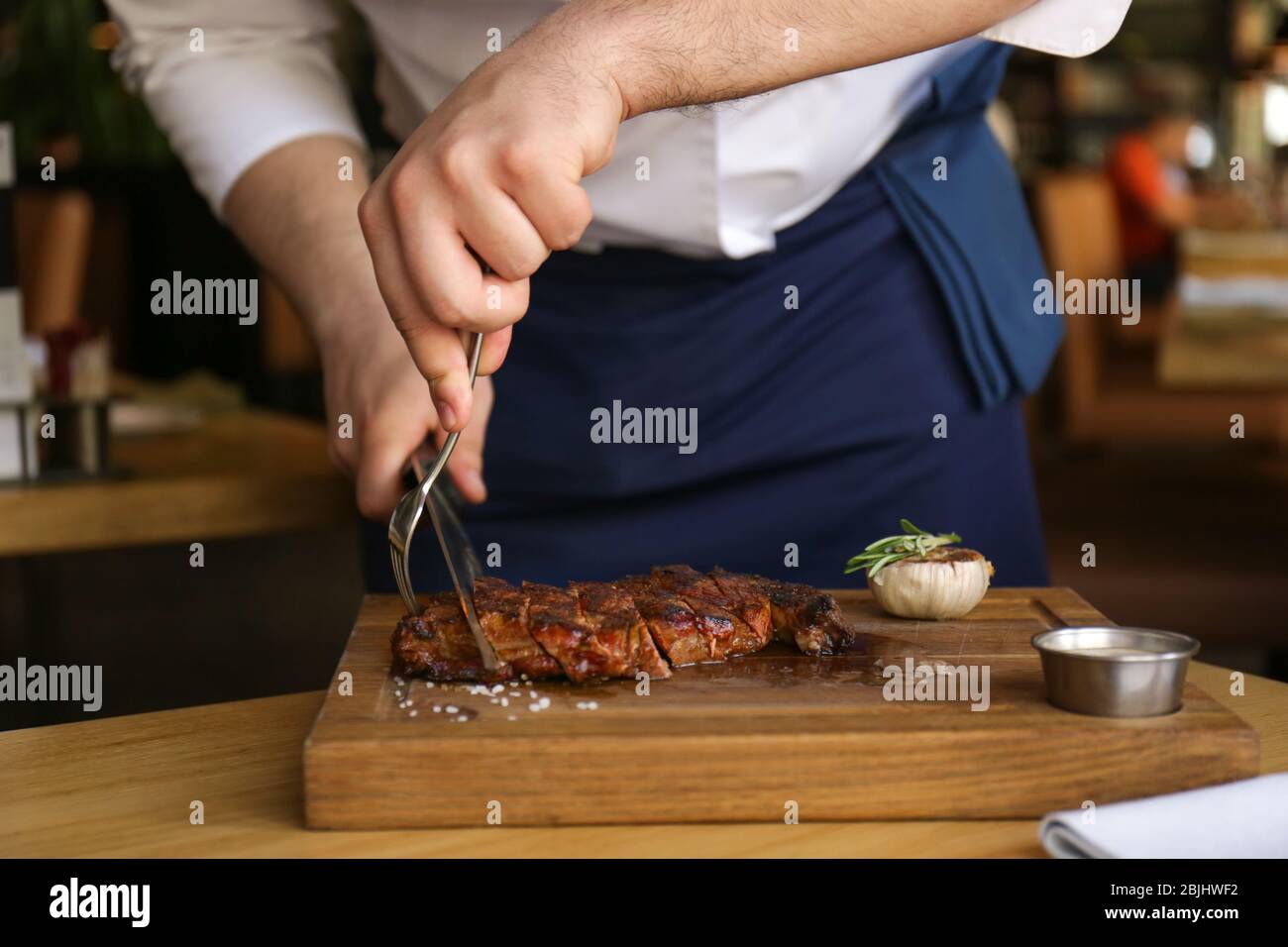 Person cutting cooked grilled hi-res stock photography and images - Alamy