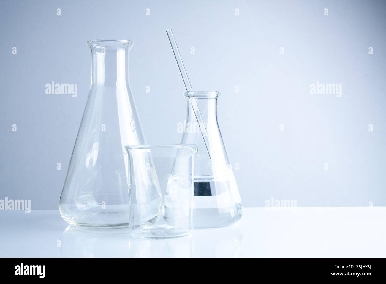 Group of laboratory glassware on table, Symbolic of science research ...