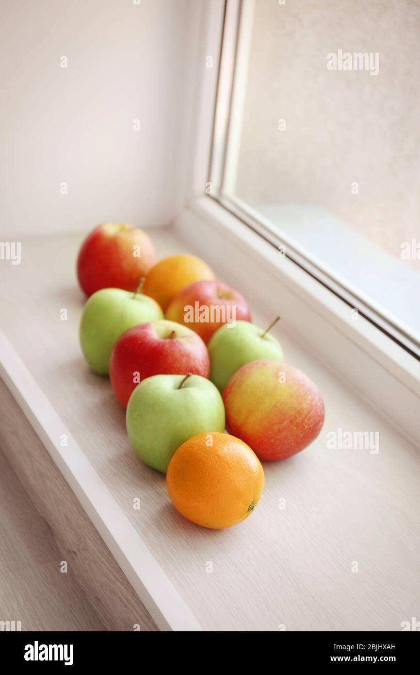 Fresh fruits on windowsill Stock Photo - Alamy