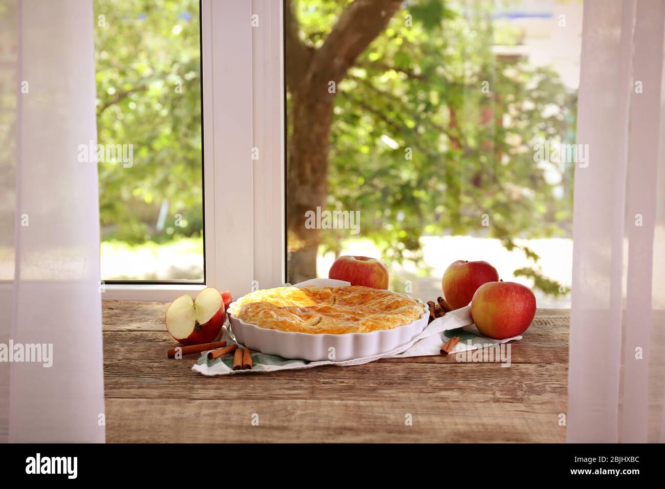 Delicious pie on windowsill Stock Photo - Alamy