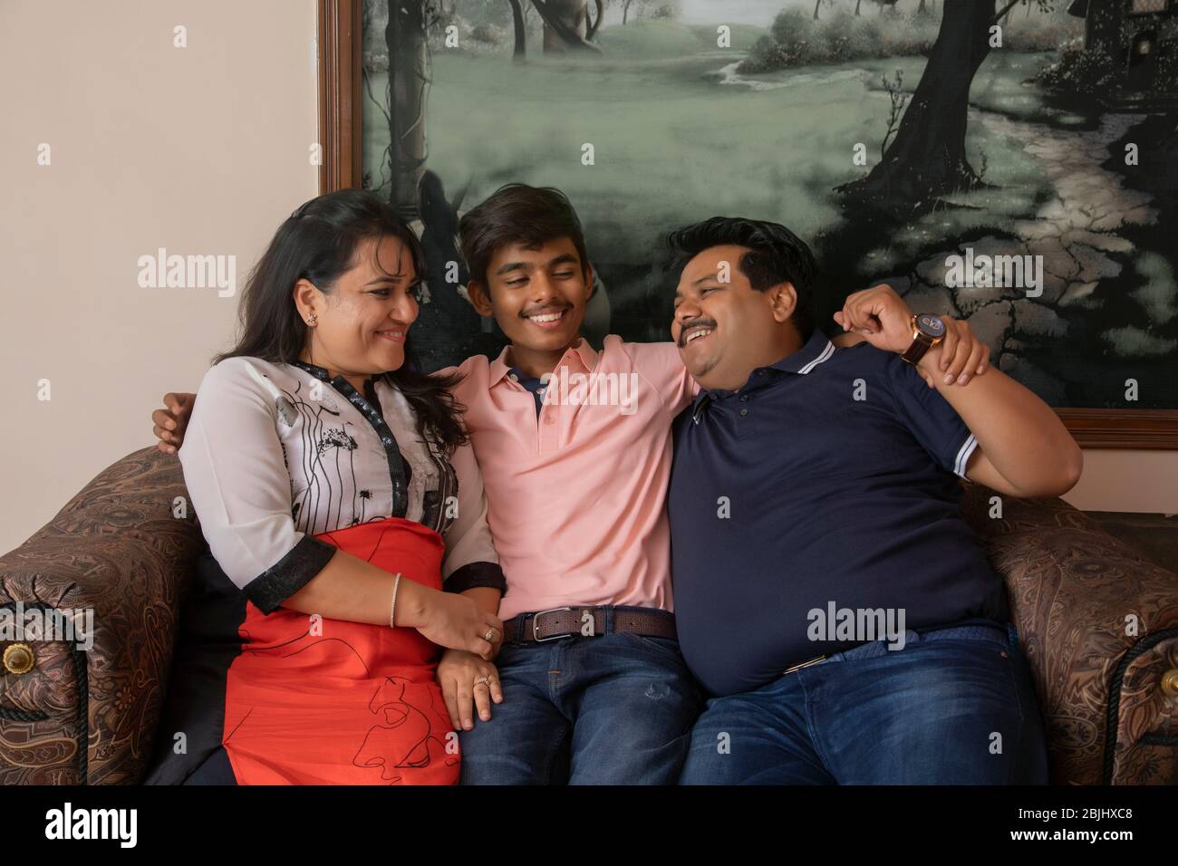 Father son sitting together couch living room hi-res stock photography ...