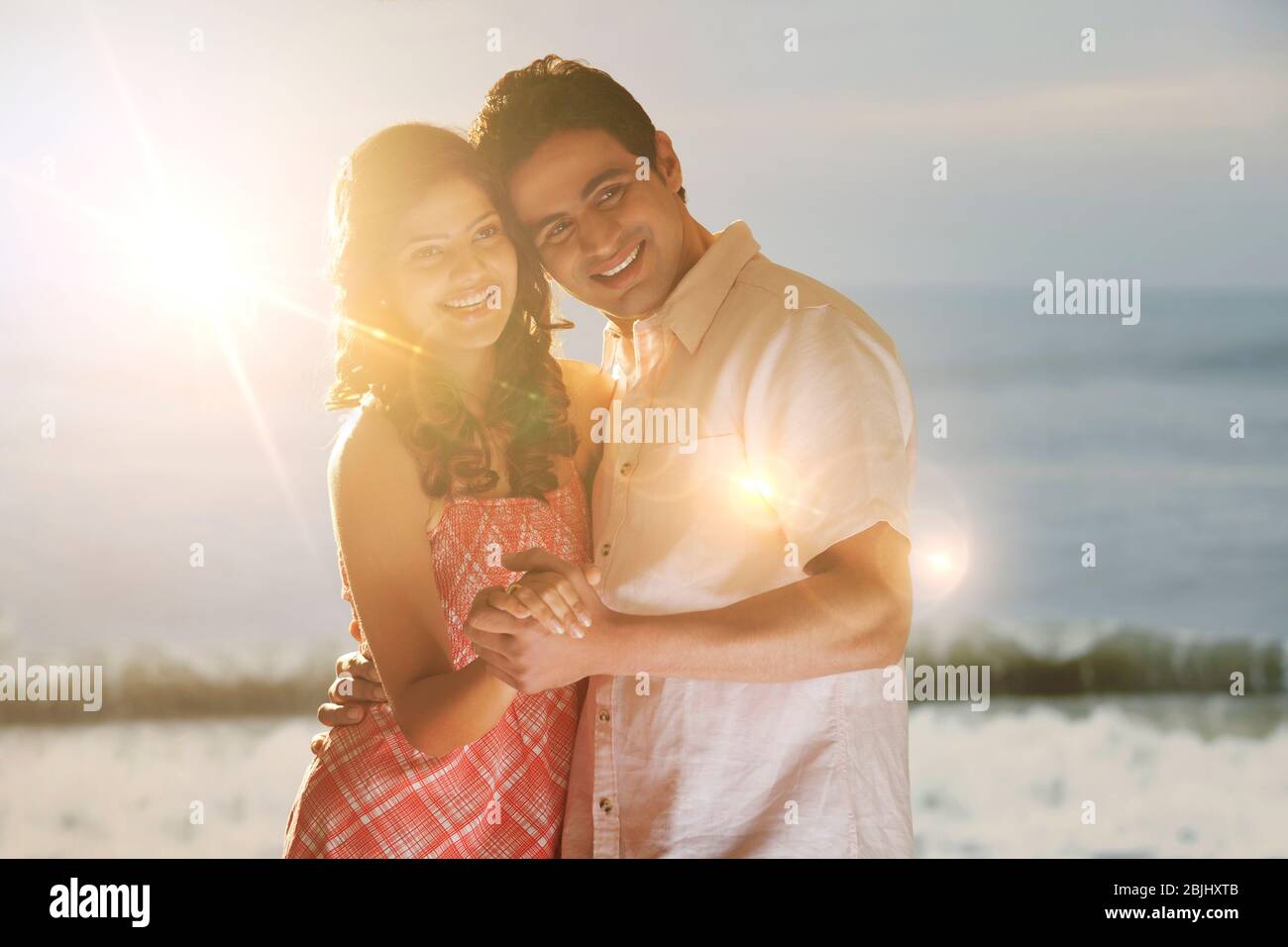 Couple holding each other Stock Photo - Alamy