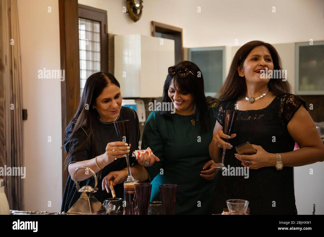 Group of women getting ready for a toast at a kitty party Stock Photo ...
