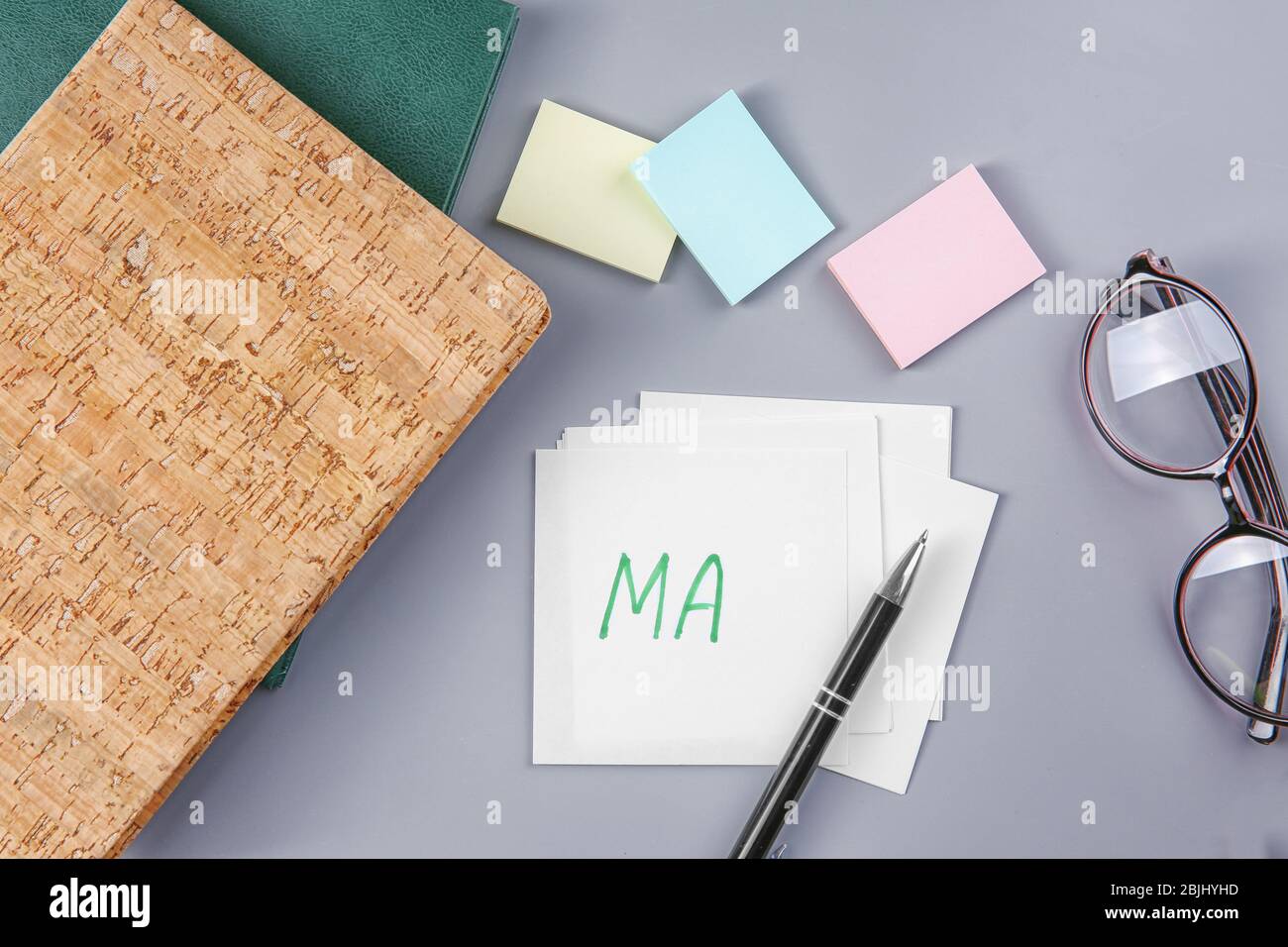 Paper sheets with written text and stationery on grey background ...