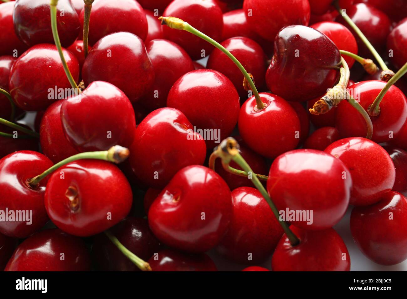 Sweet red cherries, closeup Stock Photo - Alamy