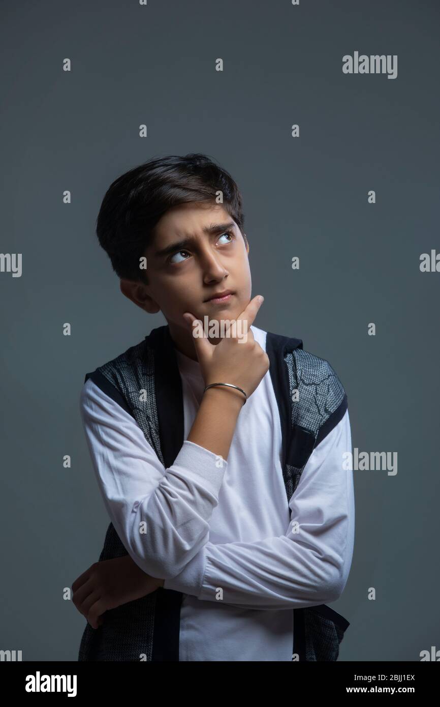 Portrait of a young boy thinking. (Children Stock Photo - Alamy