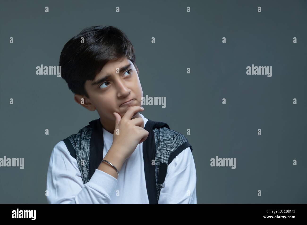 Portrait of a young boy thinking. (Children Stock Photo - Alamy