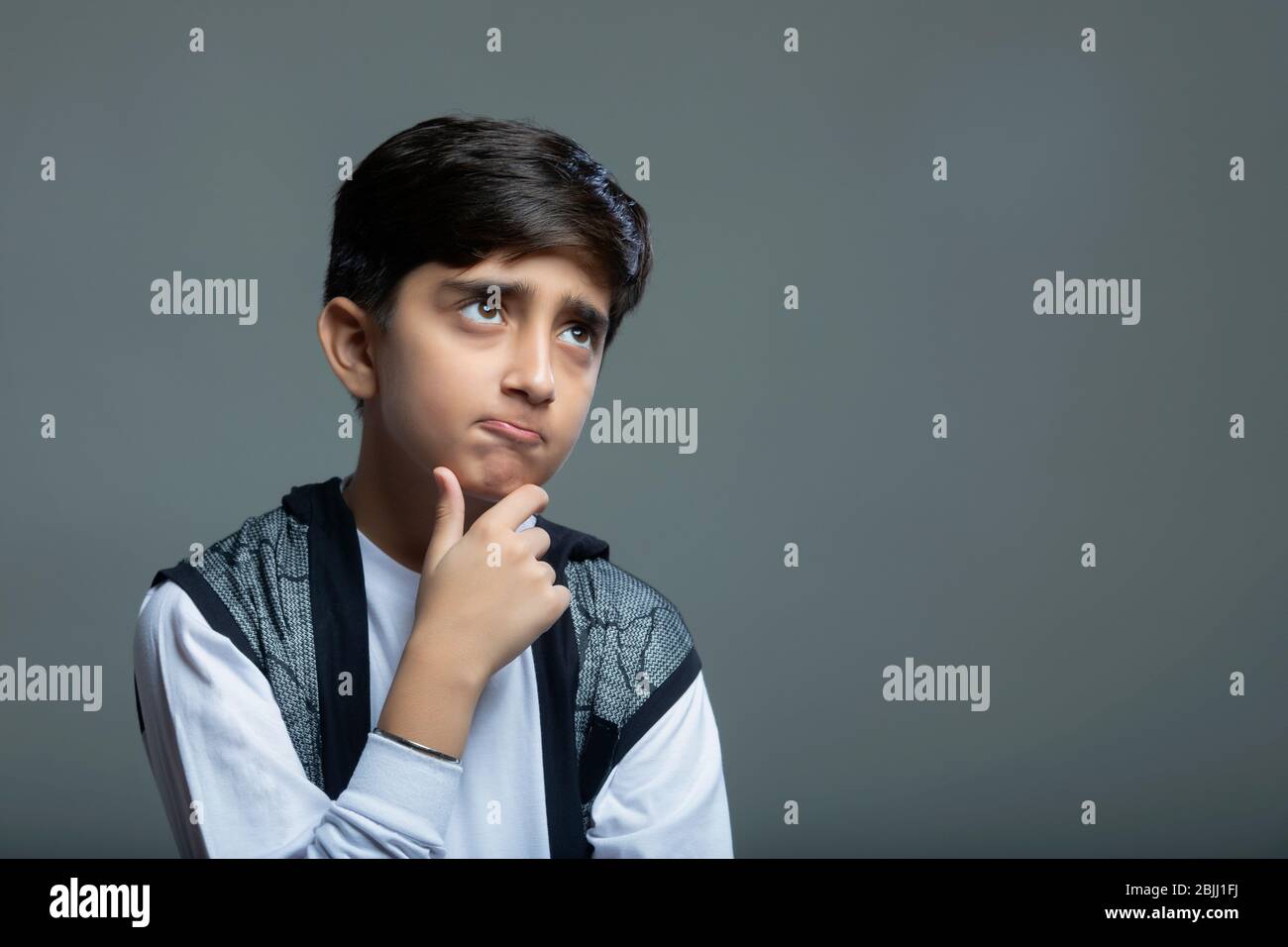 Portrait of a young boy thinking. (Children Stock Photo - Alamy