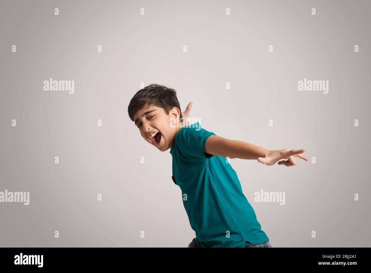Portrait of an excited happy young boy dancing. (Children Stock Photo ...