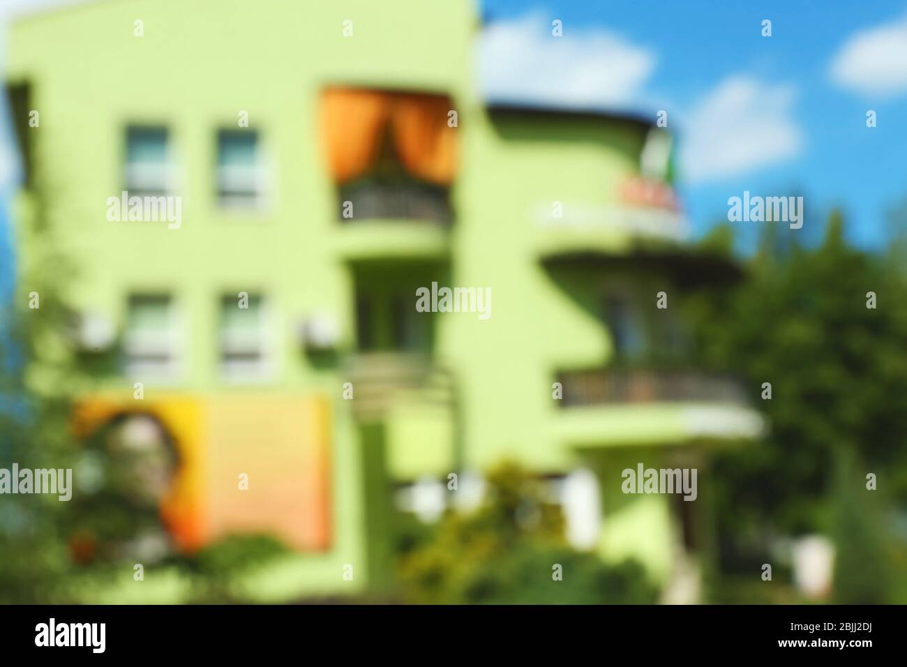 Blurred view of green building Stock Photo - Alamy