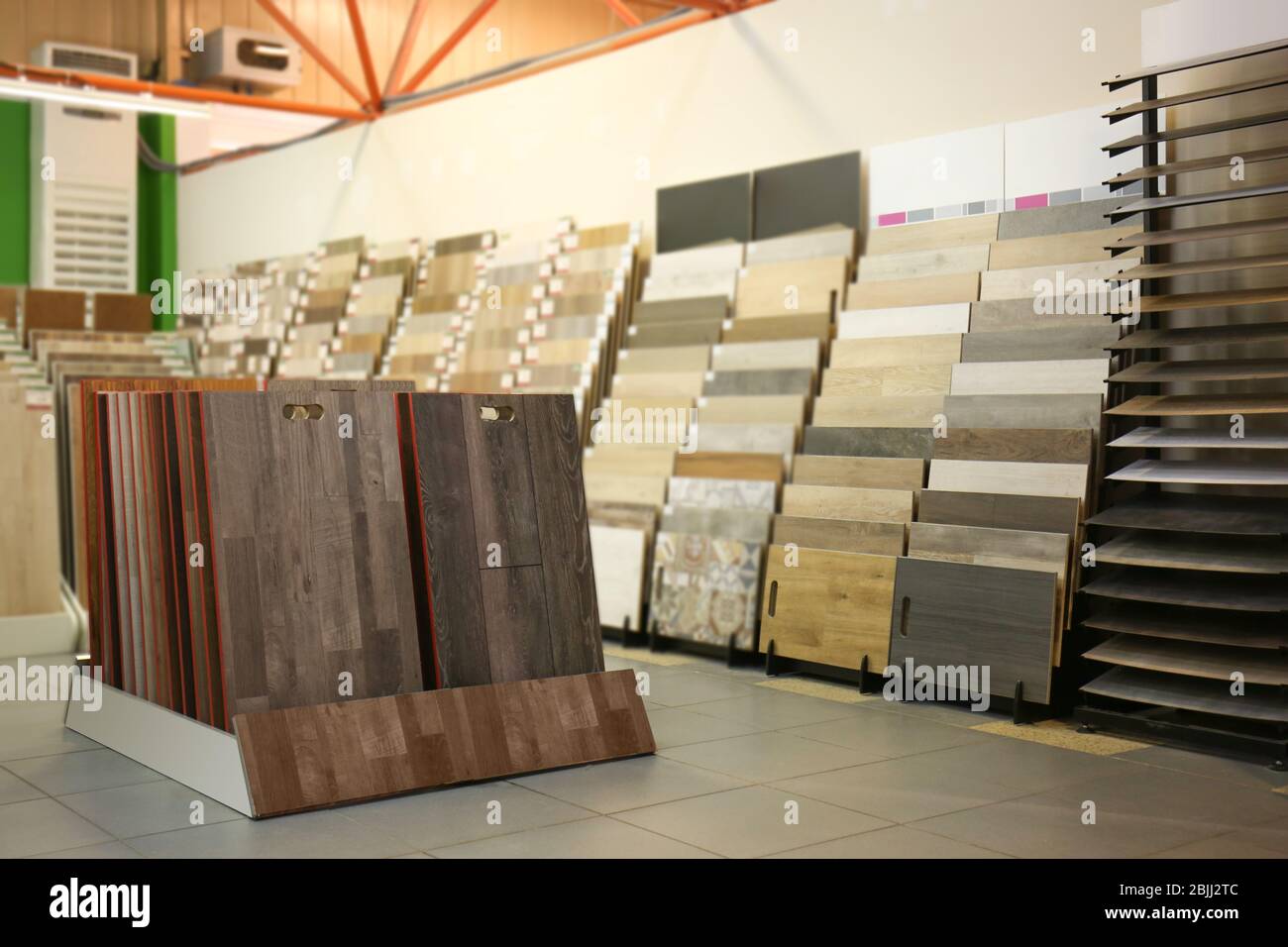 Assortment of laminated flooring samples in hardware store Stock Photo ...