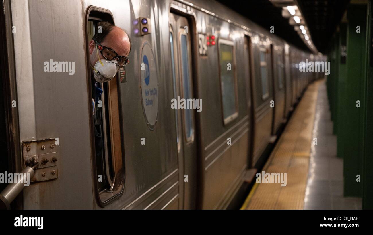 New York City, United States. 29th Apr, 2020. A train conductor wearing ...