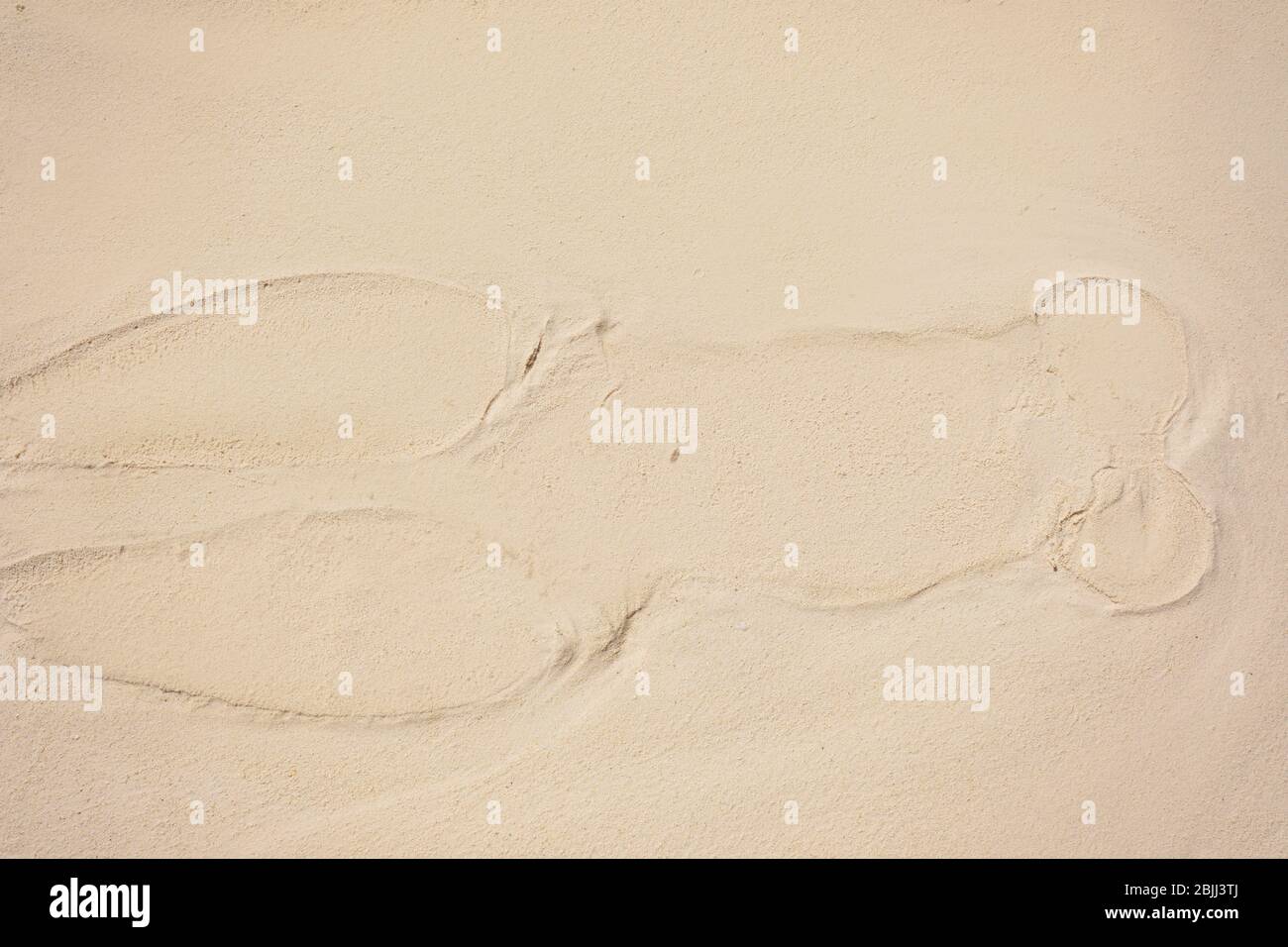 Print of female body on beach sand. Summer vacation concept Stock Photo ...