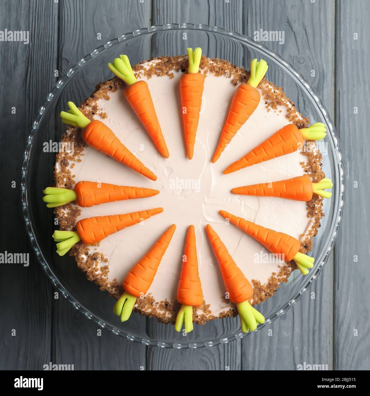 Stand with delicious carrot cake on wooden background Stock Photo - Alamy