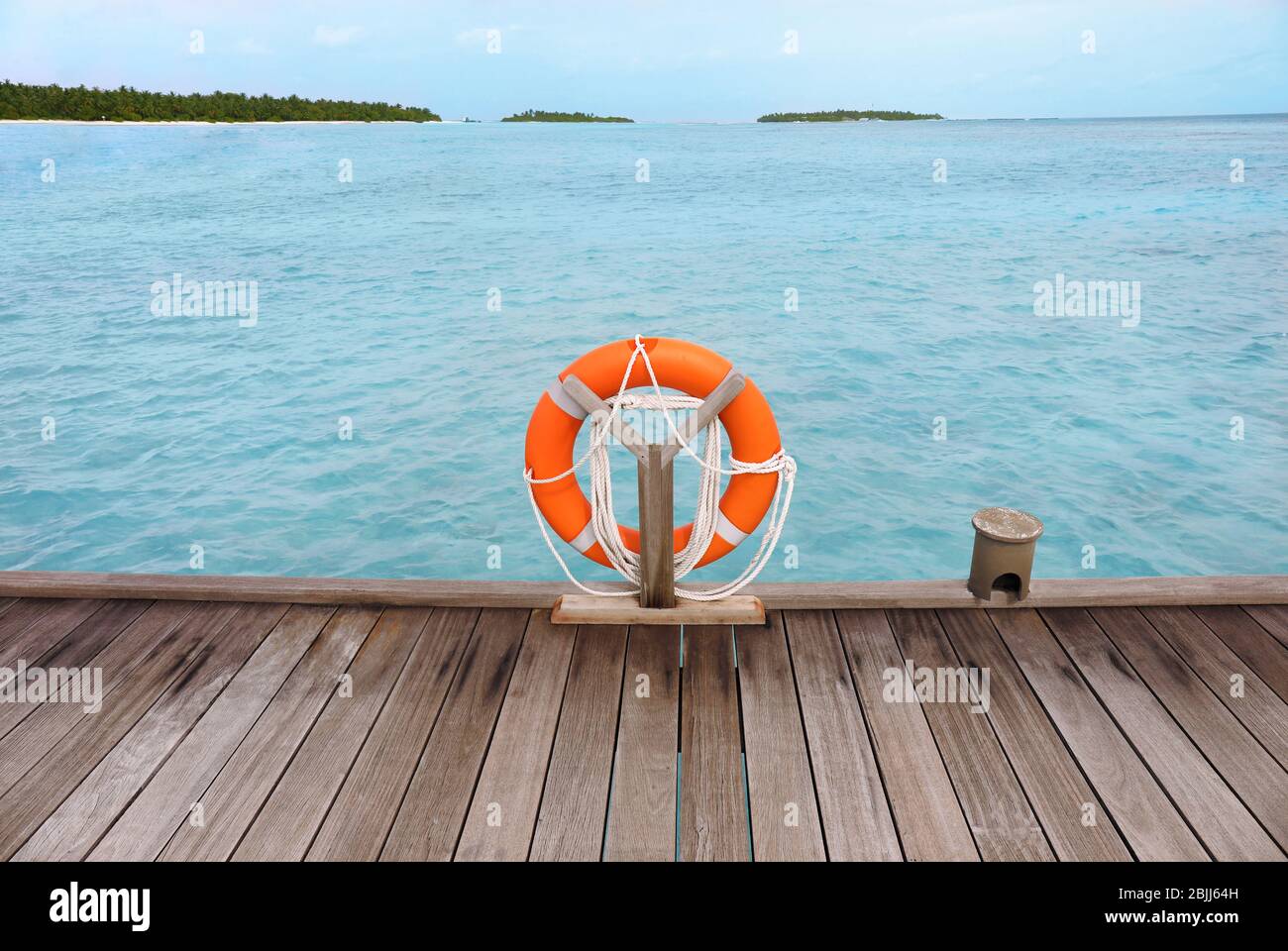 Wooden pontoon with flotation ring at sea resort Stock Photo - Alamy