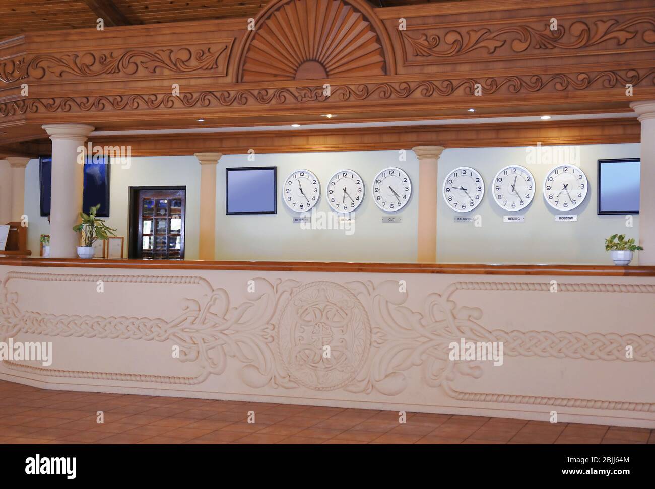 Receptionist's desk in modern hotel Stock Photo - Alamy