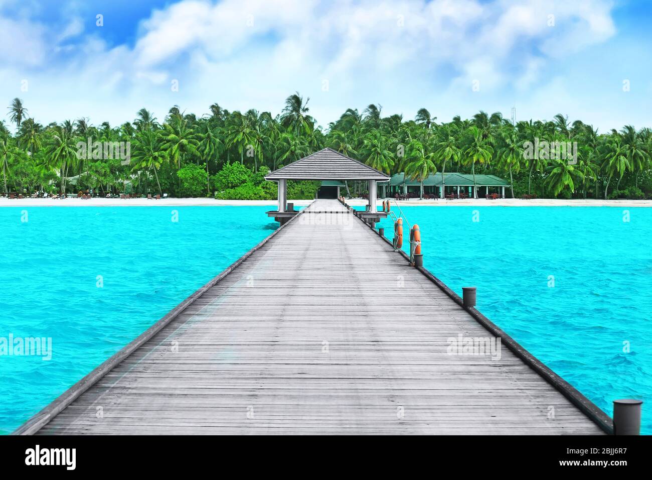 Wooden pontoon at tropical resort on summer day Stock Photo - Alamy