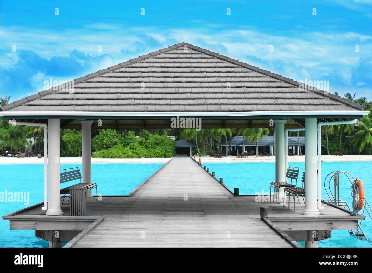 Shelter shed and wooden pontoon at tropical resort on summer day Stock ...