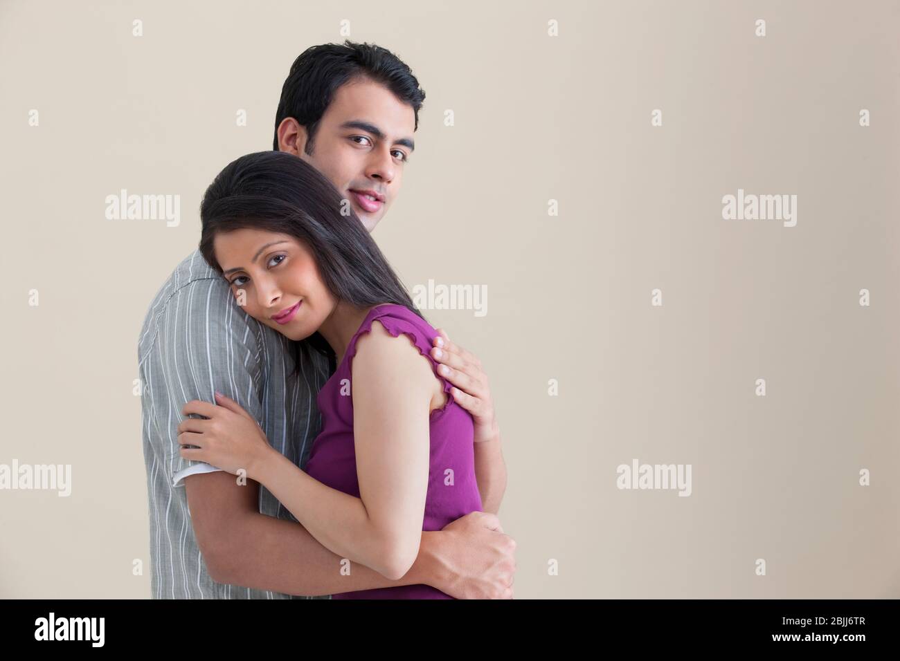 Portrait of married couple hugging Stock Photo - Alamy