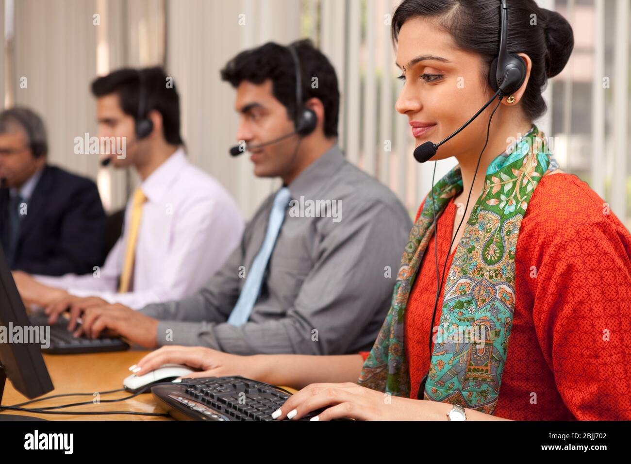 Call center agents working Stock Photo - Alamy