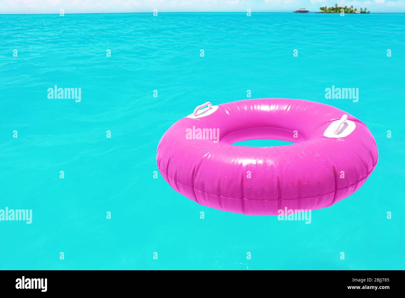 Inflatable rubber ring in clear sea water Stock Photo - Alamy