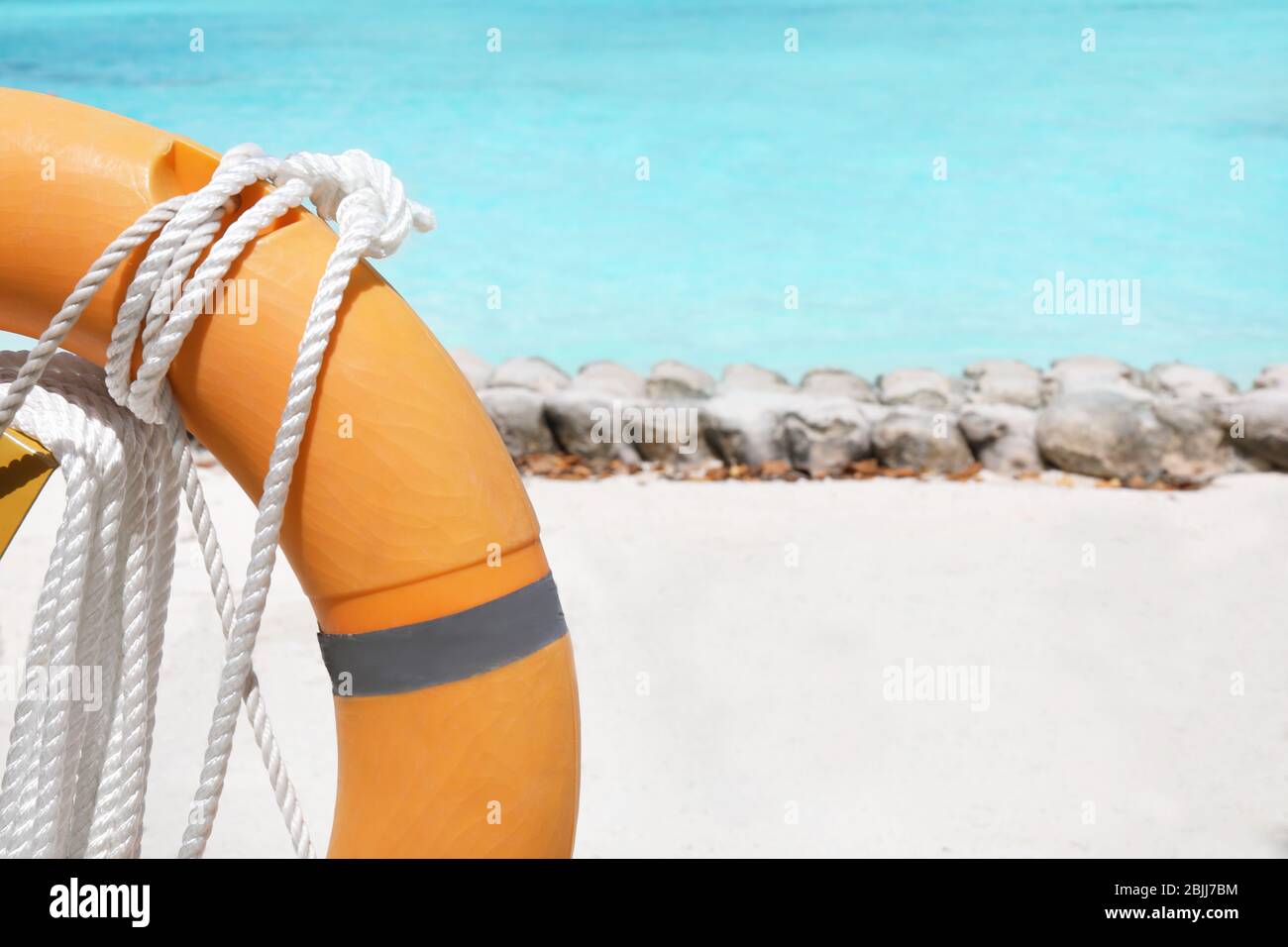 Flotation ring on beach at sea resort, closeup Stock Photo - Alamy