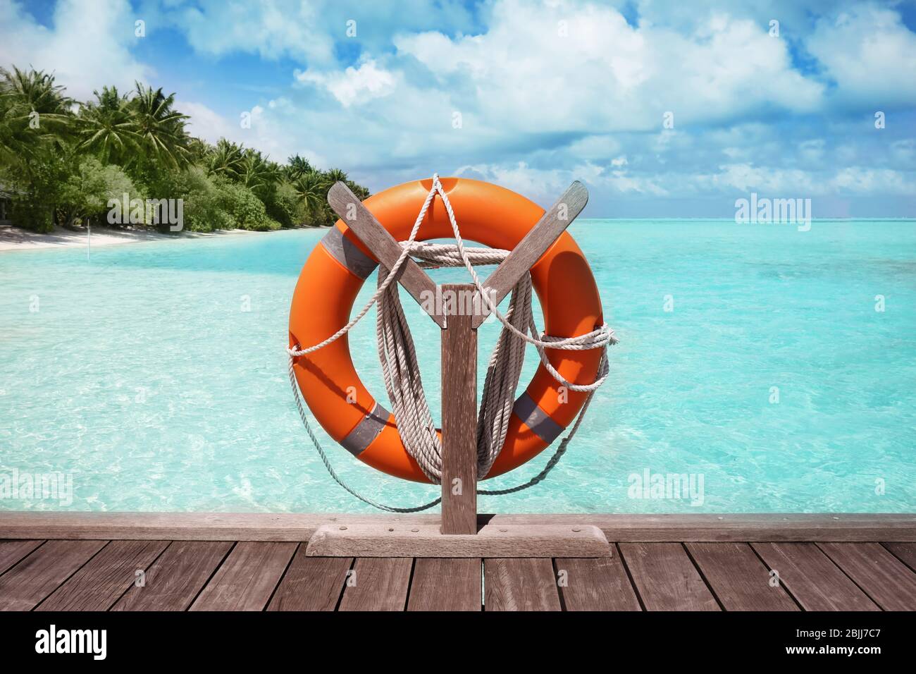 Wooden pontoon with flotation ring at sea resort Stock Photo - Alamy