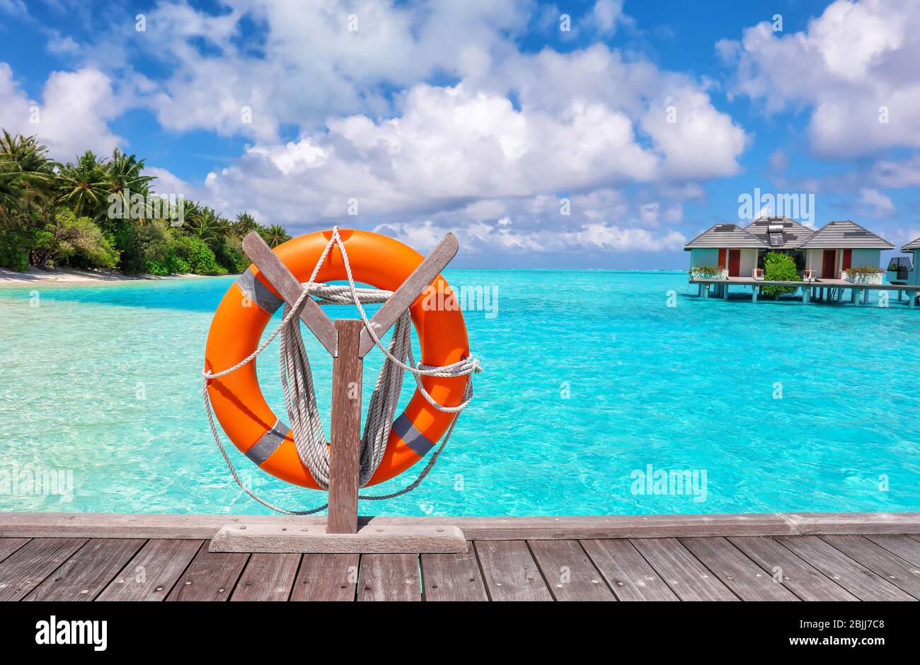 Wooden pontoon with flotation ring at tropical resort Stock Photo - Alamy