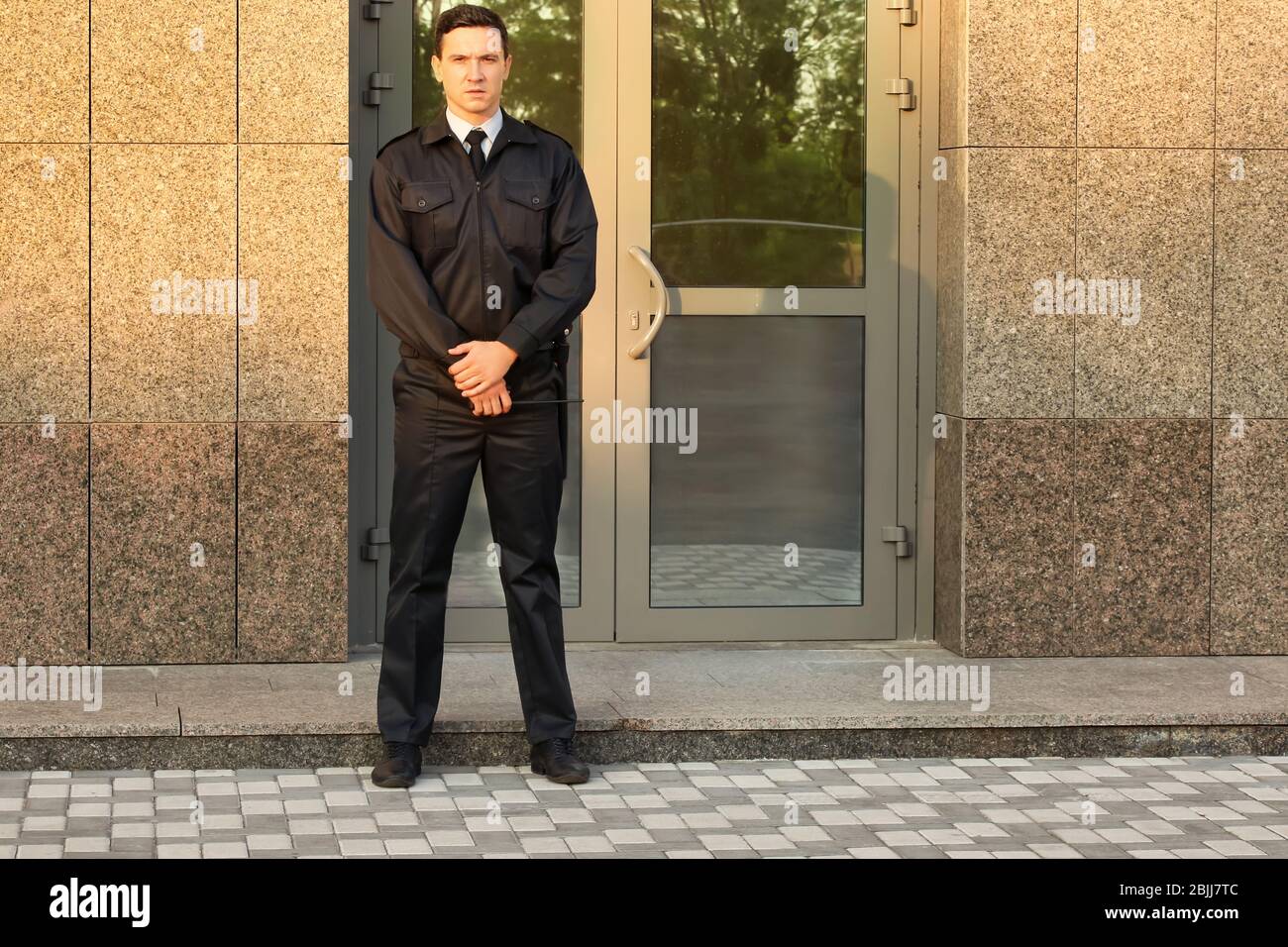 Male security guard, outdoors Stock Photo - Alamy