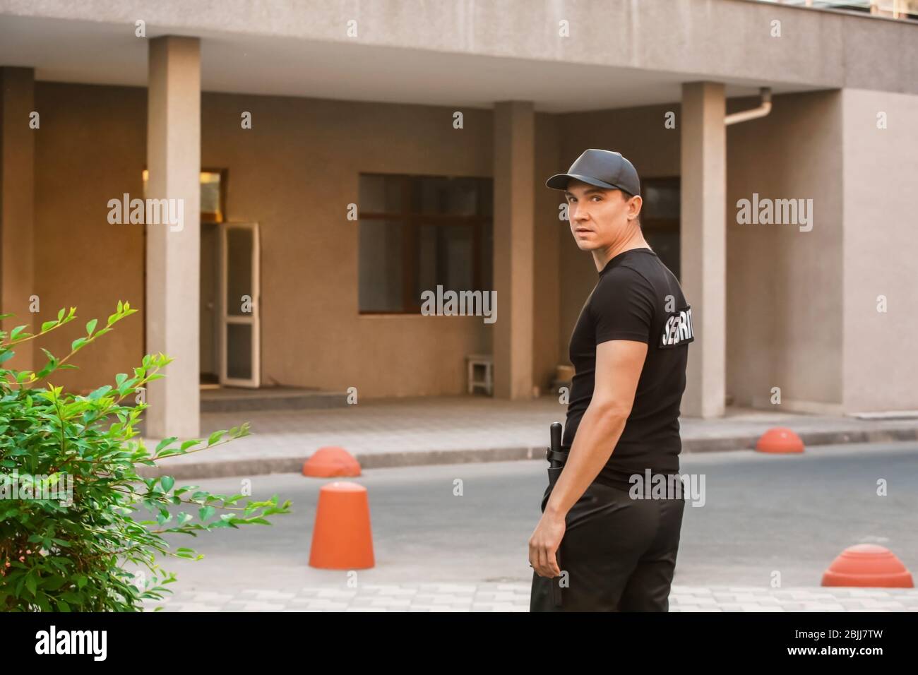 Male security guard, outdoors Stock Photo - Alamy
