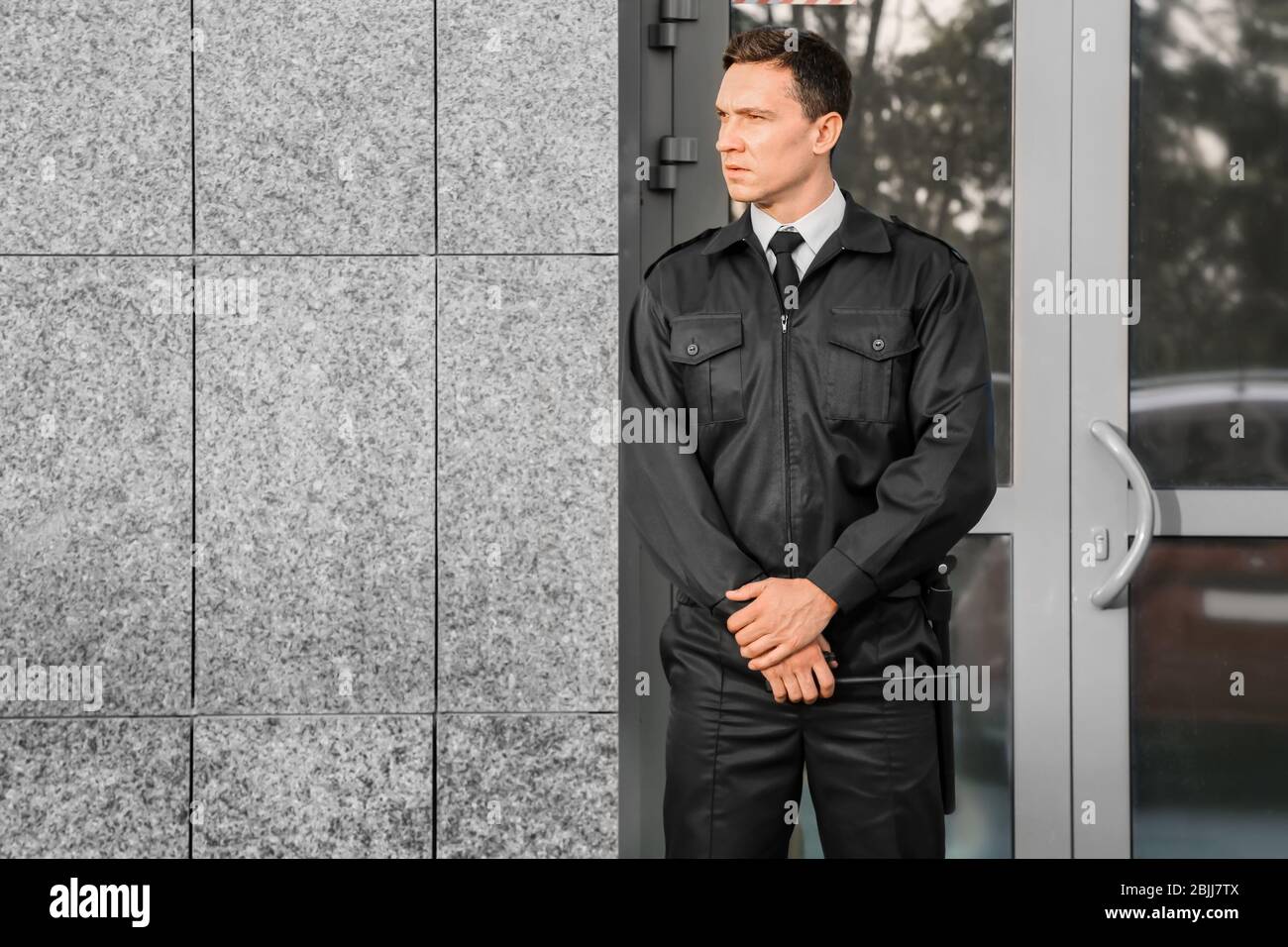 Male security guard, outdoors Stock Photo - Alamy