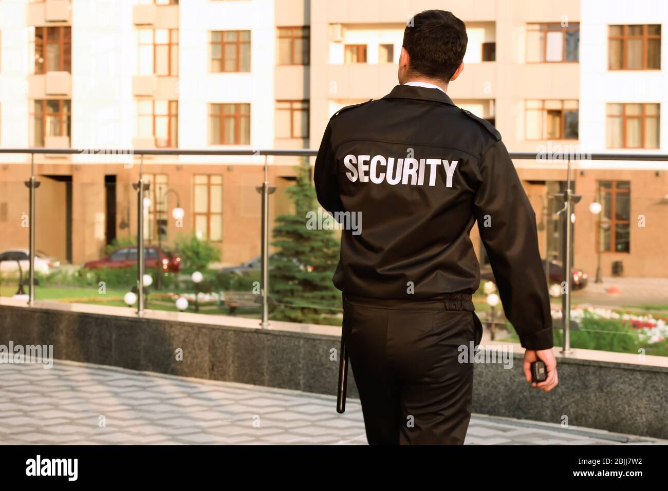 Male security guard, outdoors Stock Photo - Alamy