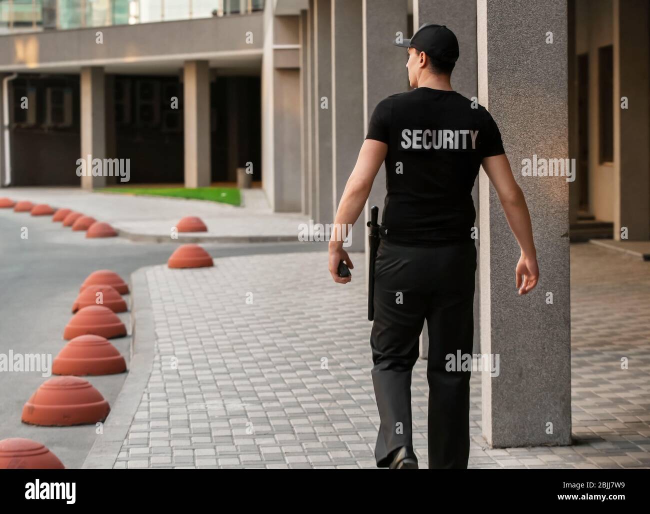 Male security guard, outdoors Stock Photo - Alamy