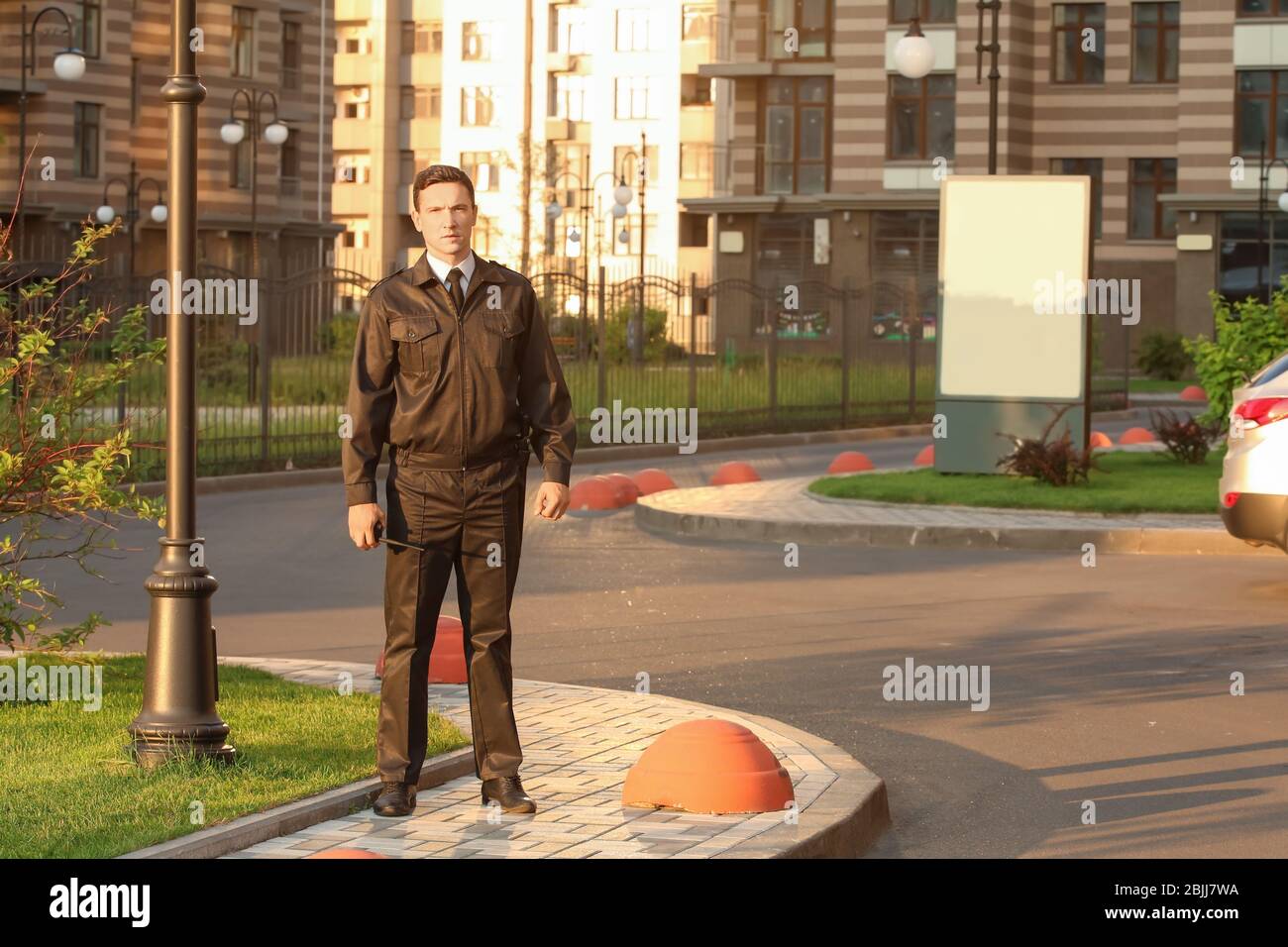 Male security guard, outdoors Stock Photo - Alamy