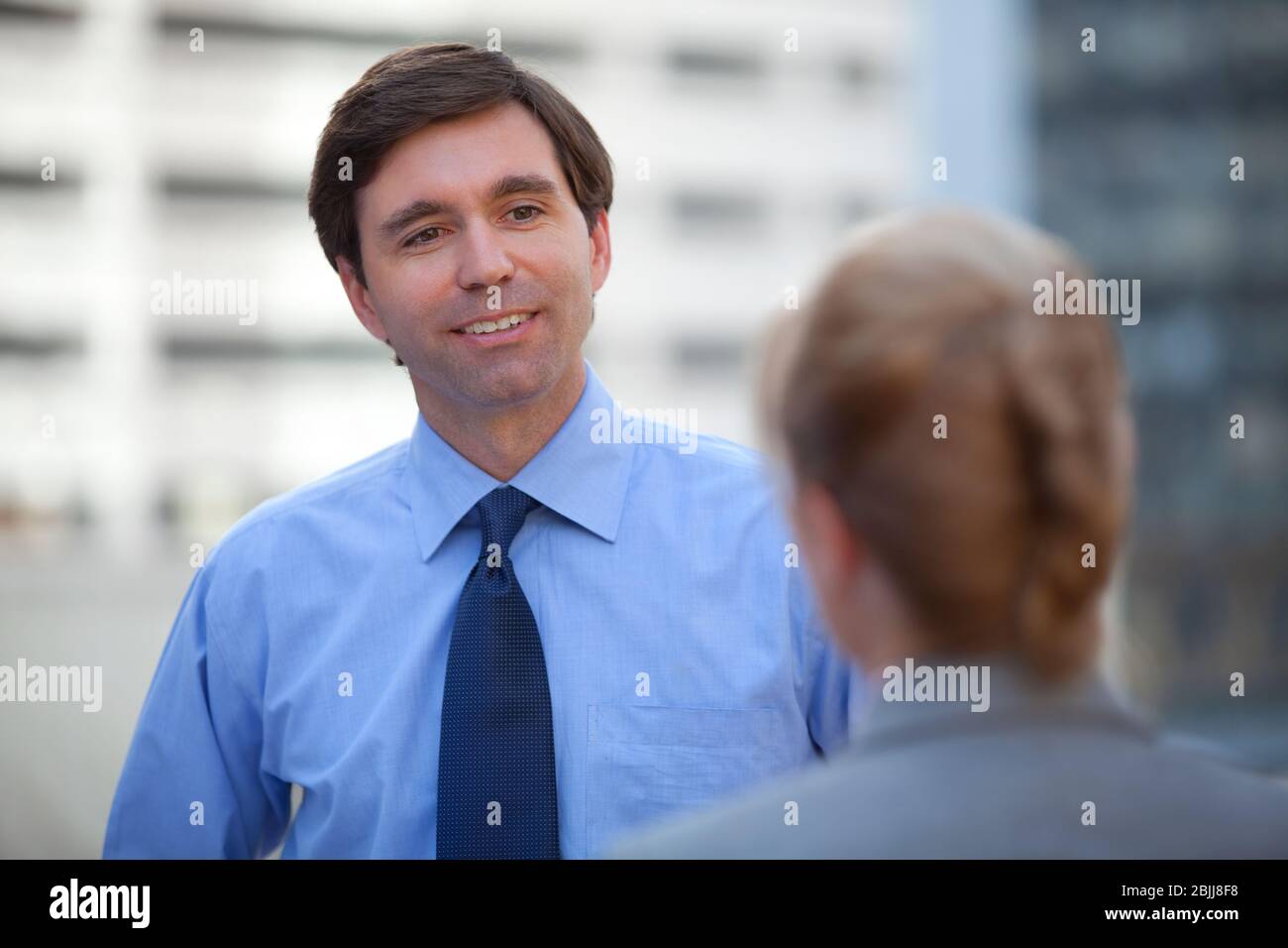 Business executives talking Stock Photo - Alamy