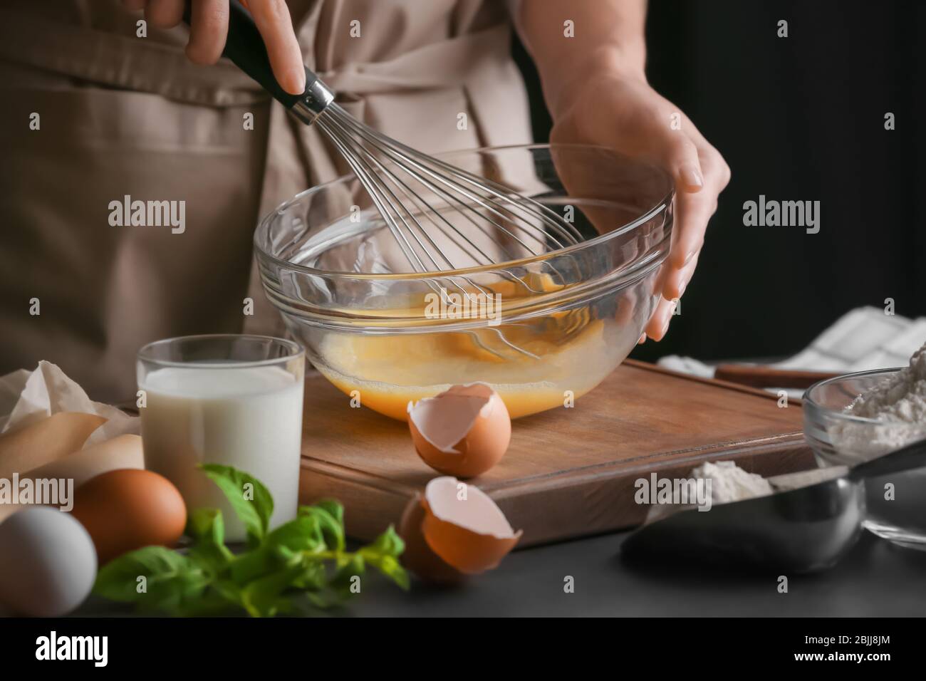 Woman whisking milk in hi-res stock photography and images - Alamy