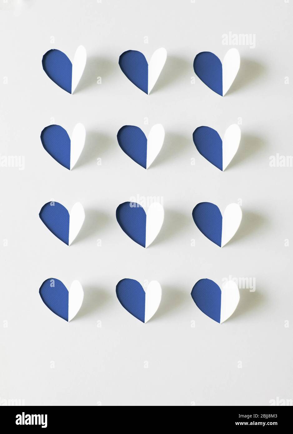 Classic Blue. Color of the Year 2020. Hearts cut out of white paper ...