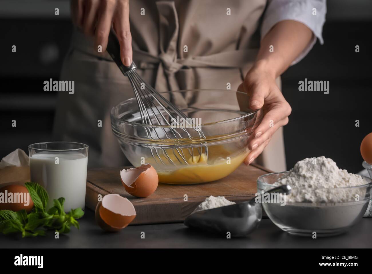 Woman whisking milk in hi-res stock photography and images - Alamy