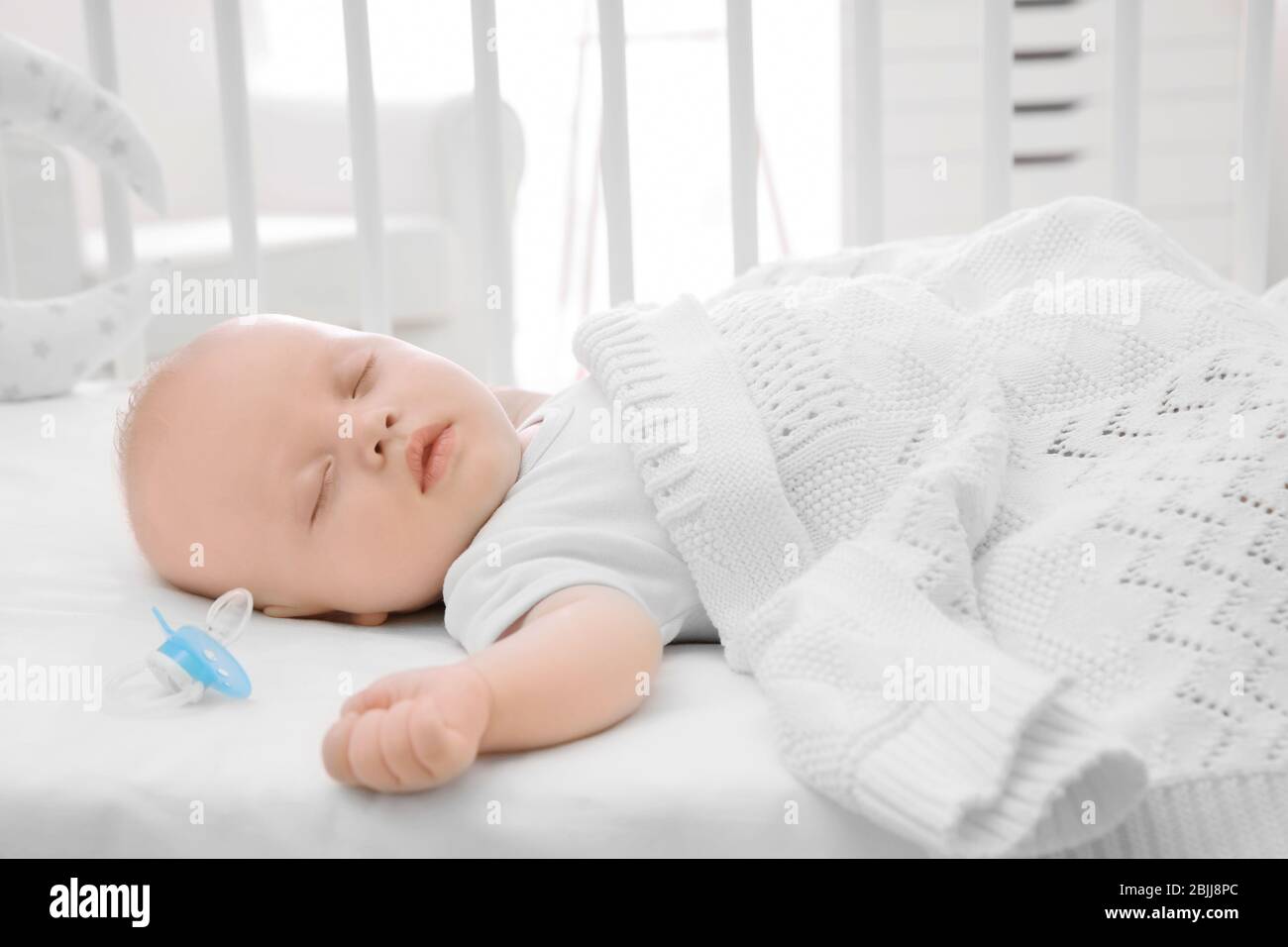 Adorable baby sleeping in cradle at home Stock Photo - Alamy