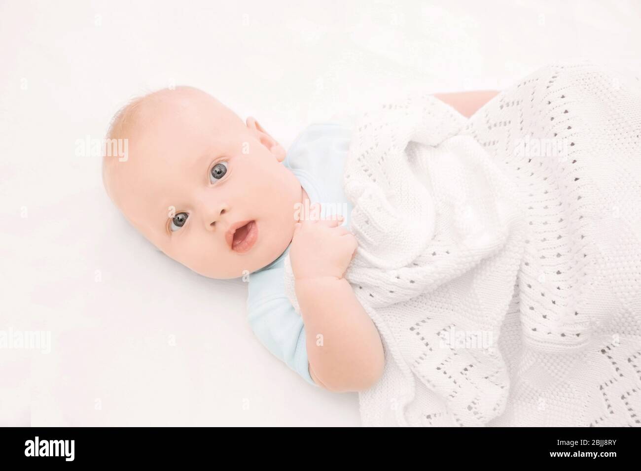 Emotional baby lying in cradle. Insomnia and sleep disorders concept ...