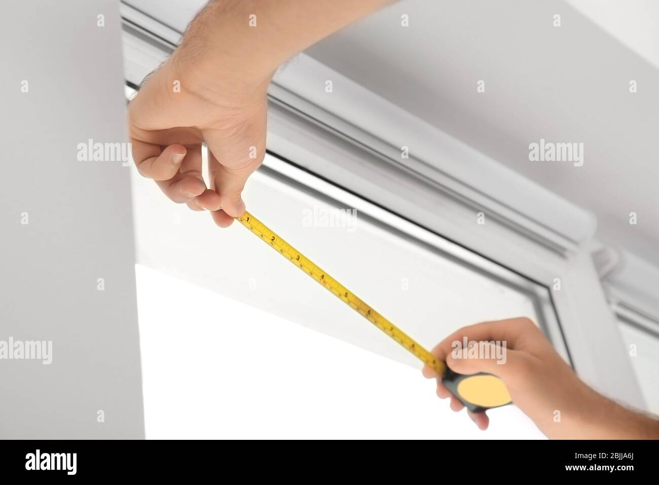 Man measuring window frame hi-res stock photography and images - Alamy