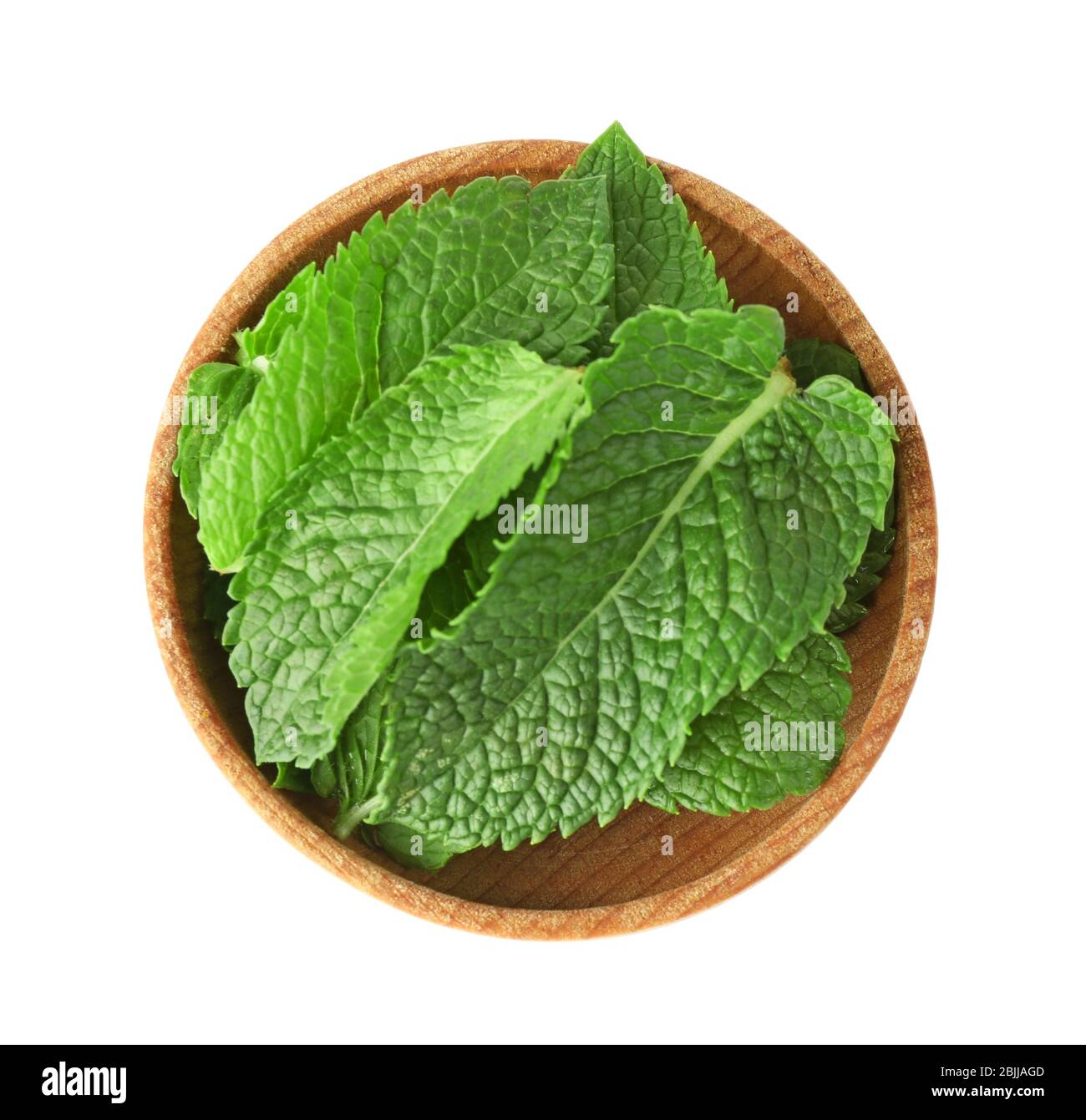 Wooden bowl with fresh mint leaves on white background Stock Photo - Alamy